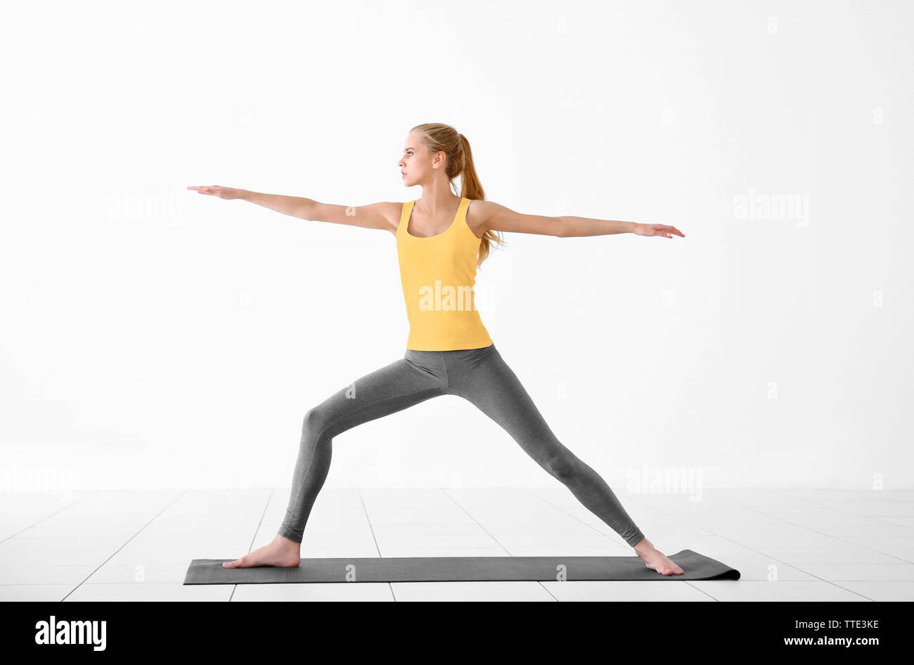 Young woman do yoga exercises Stock Photo - Alamy
