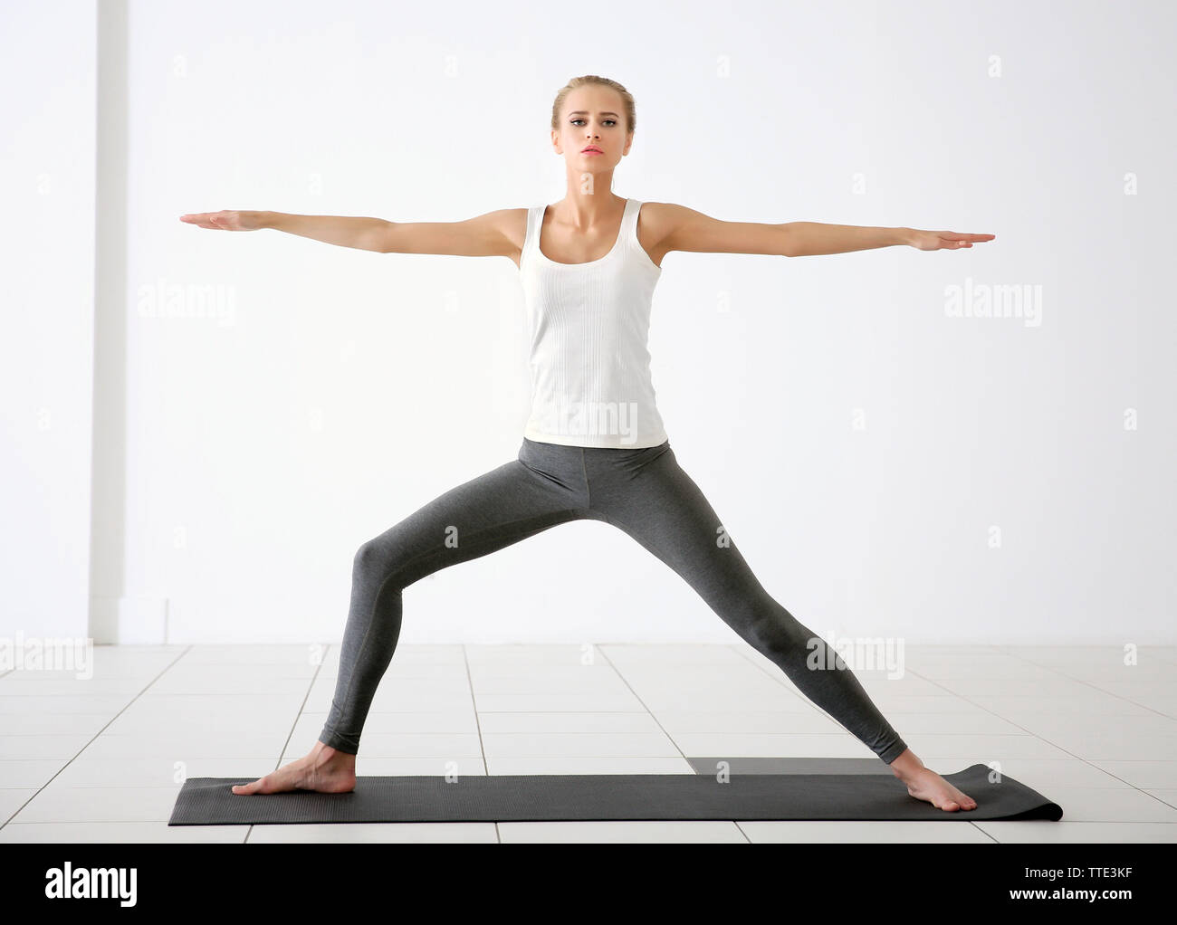 Young woman do yoga exercises Stock Photo - Alamy