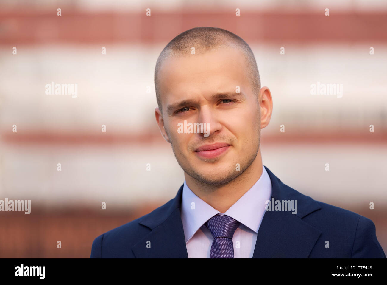 Young handsome business man in city street Stylish trendy male model ...