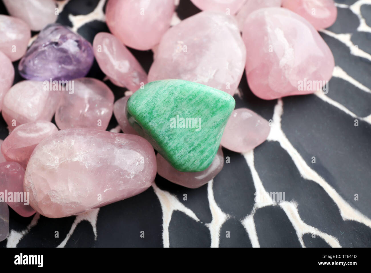 Beautiful mineral stones on grey surface Stock Photo - Alamy