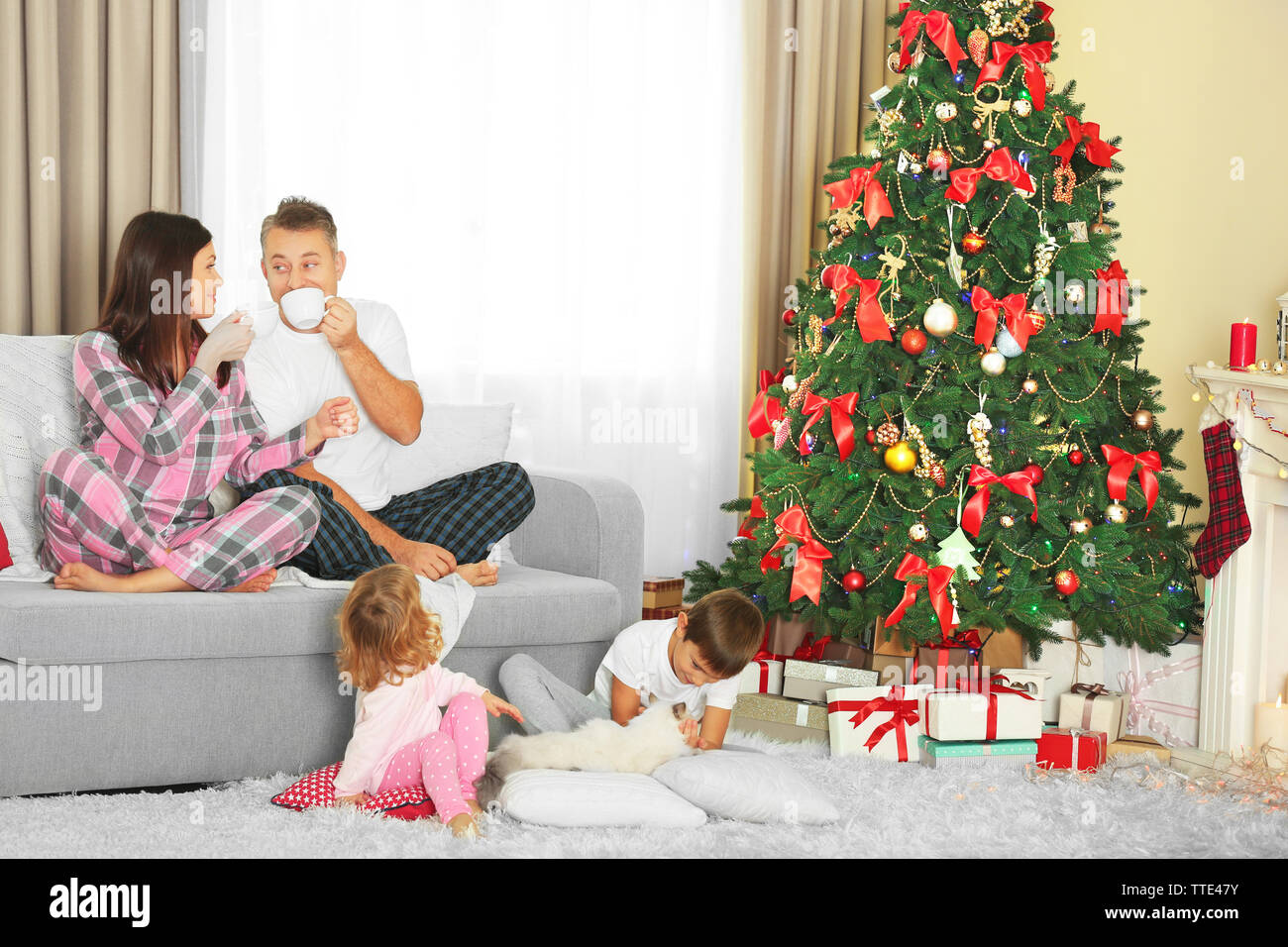 Christmas family portrait in home holiday living room, at christmas ...