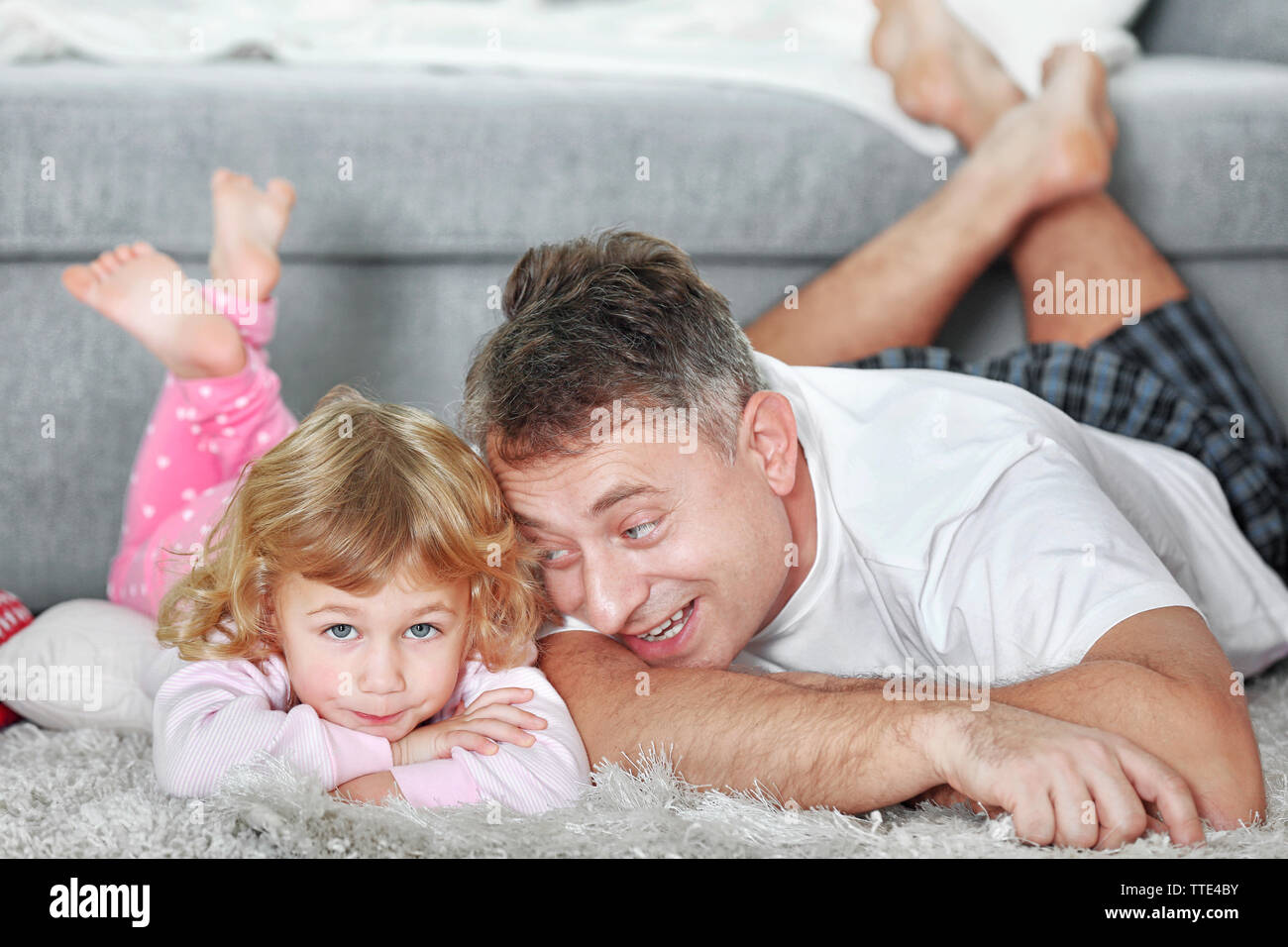 Father and daughter on home interior background Stock Photo - Alamy