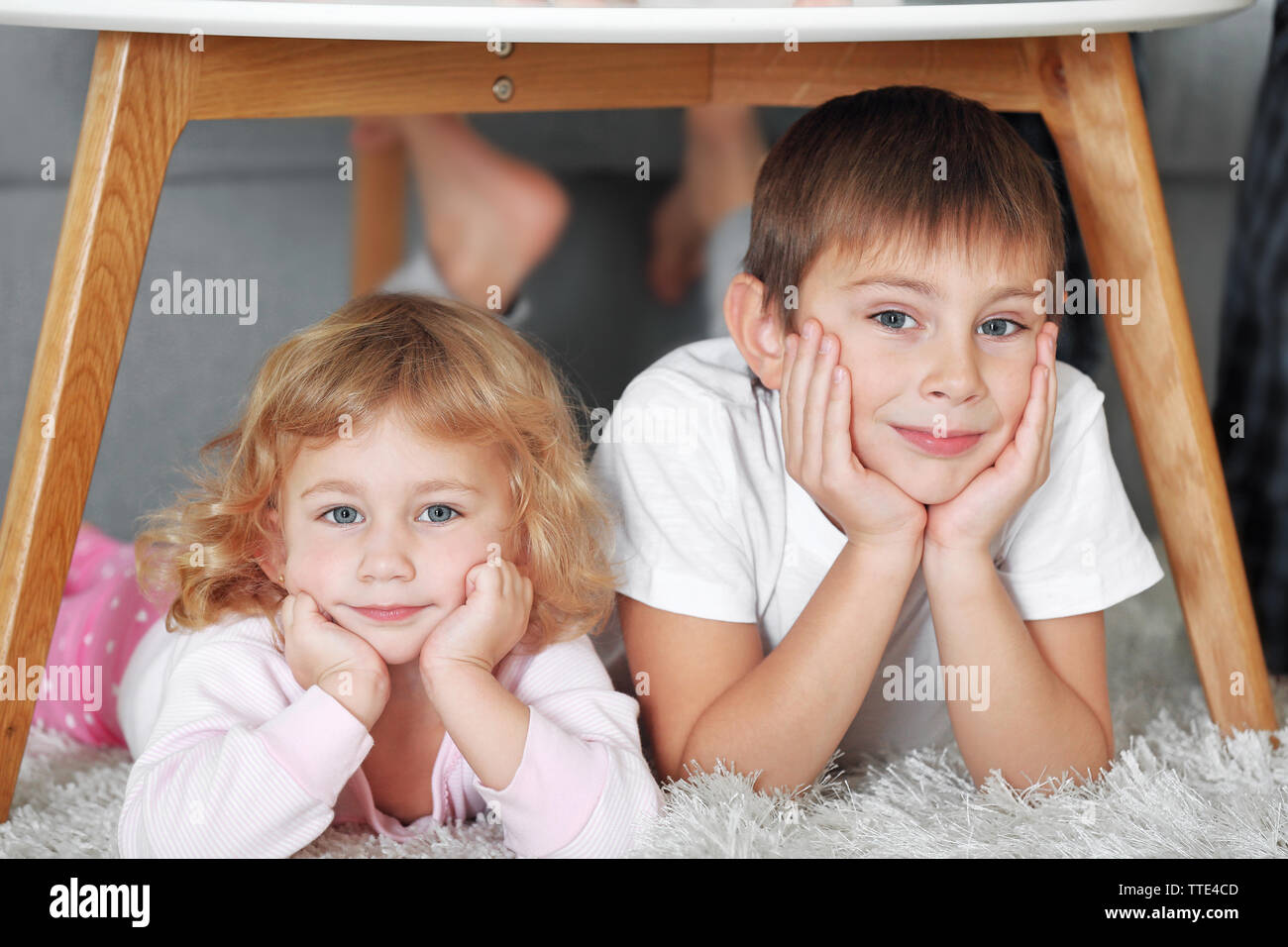 Baby looking under table hi-res stock photography and images - Alamy