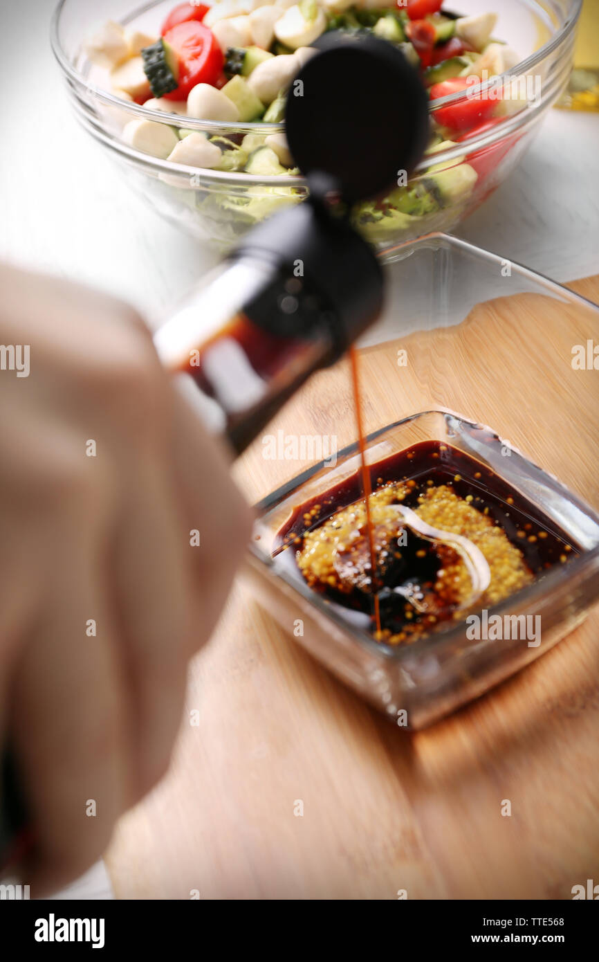 Process of preparing sauce for salad, at kitchen Stock Photo - Alamy