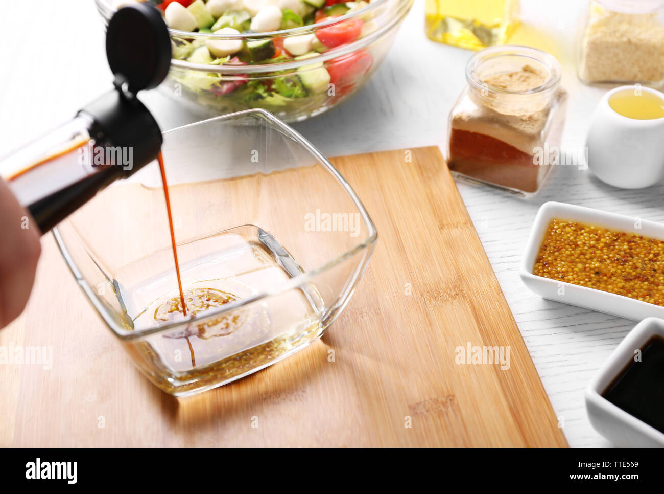 Process of preparing sauce for salad, at kitchen Stock Photo - Alamy