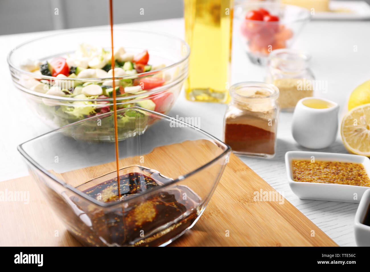 Process of preparing sauce for salad, at kitchen Stock Photo - Alamy