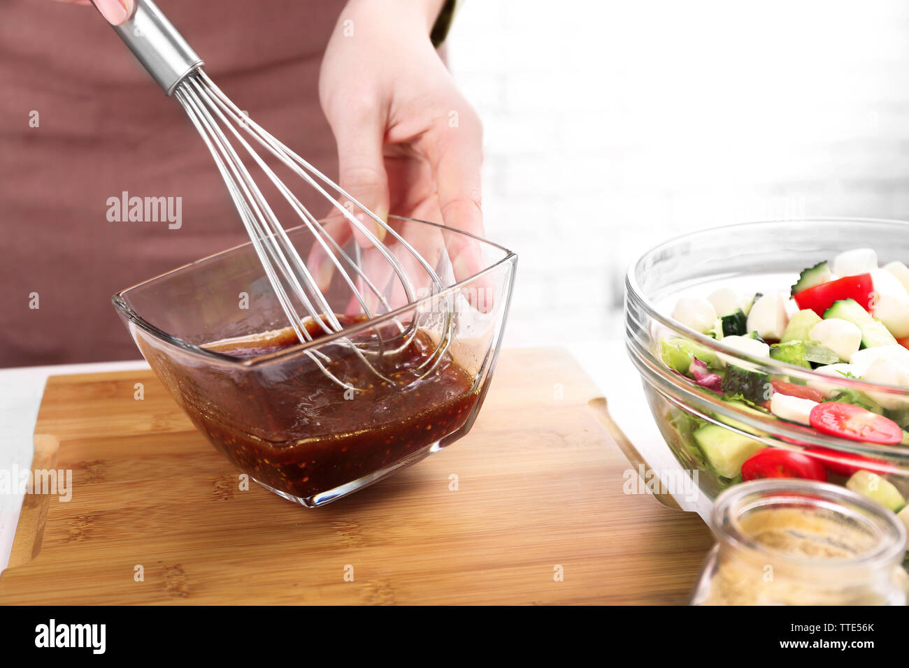 Process of preparing sauce for salad, at kitchen Stock Photo - Alamy