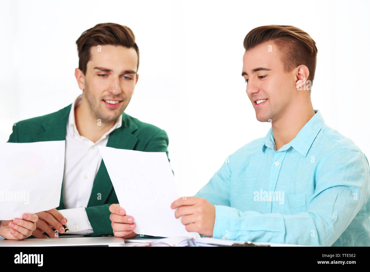 Young business men at the meeting in a conference room Stock Photo - Alamy