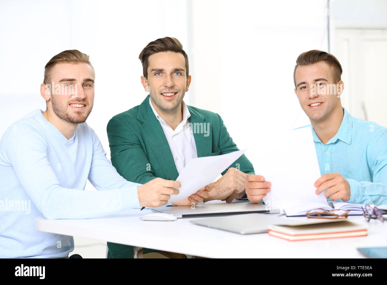 Young business men at the meeting in a conference room Stock Photo - Alamy
