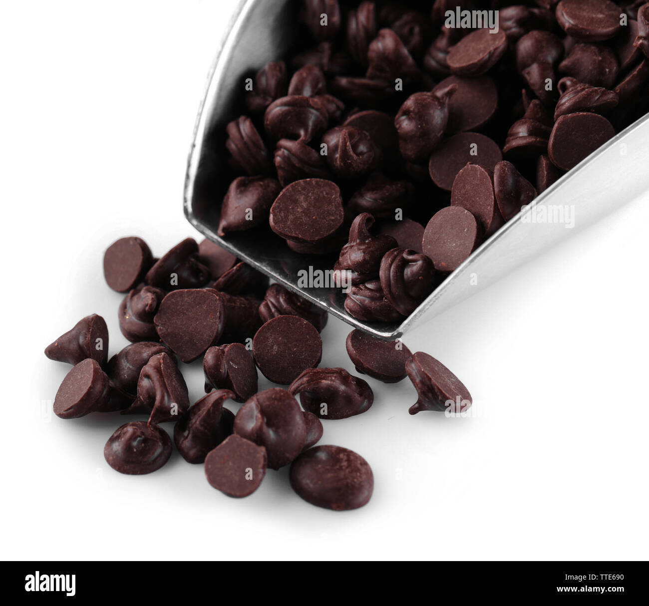 Chocolate morsels in scoop isolated on white Stock Photo - Alamy