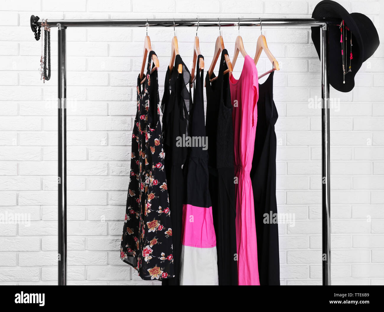 Collection of female clothes hanging on a rack Stock Photo - Alamy