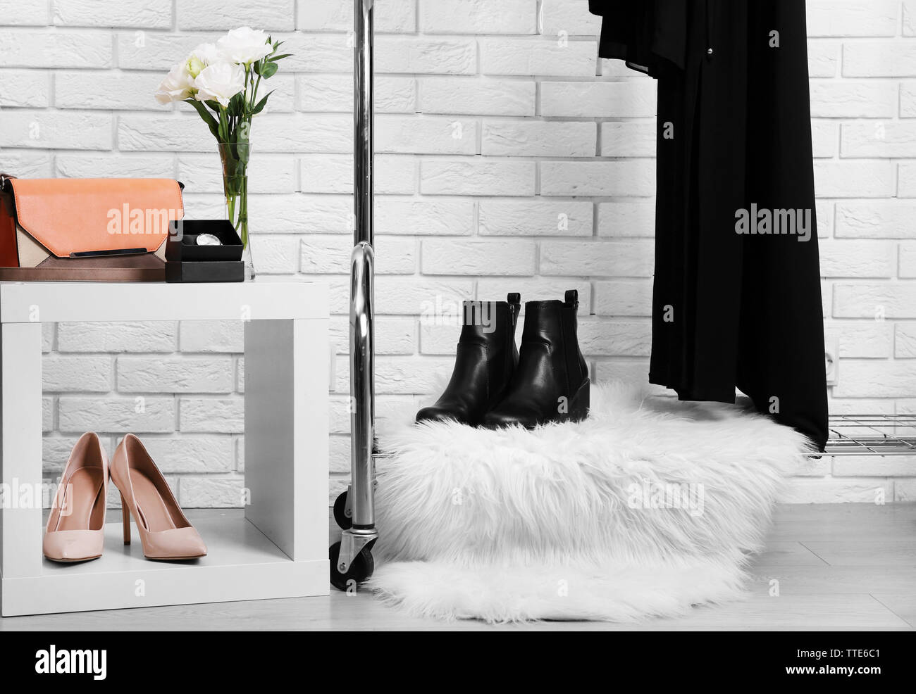 Collection of female clothes hanging on a rack Stock Photo - Alamy