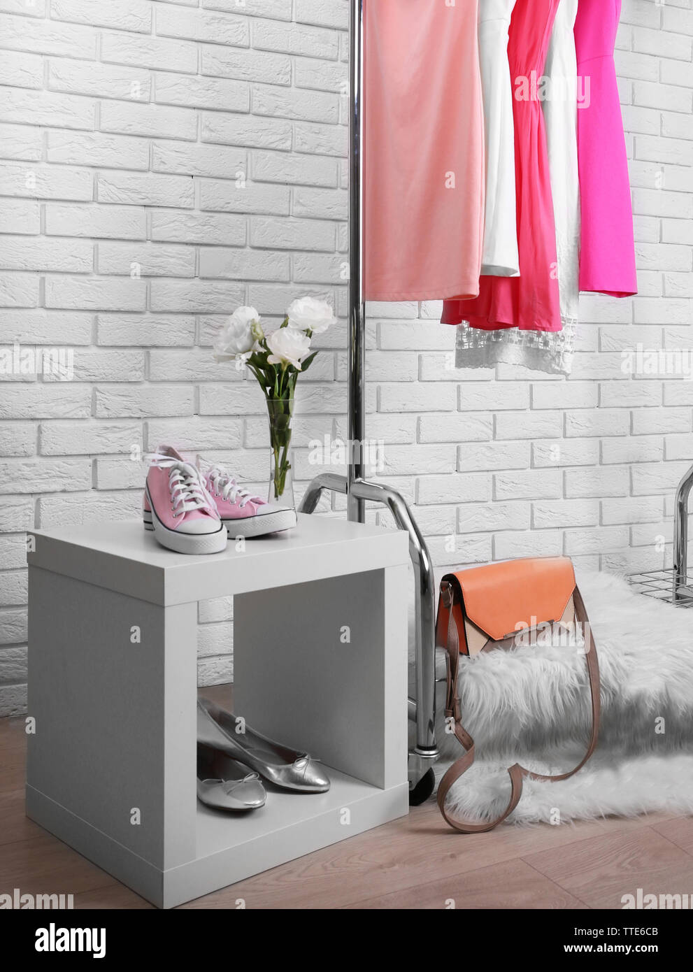 Collection of female clothes hanging on a rack Stock Photo - Alamy