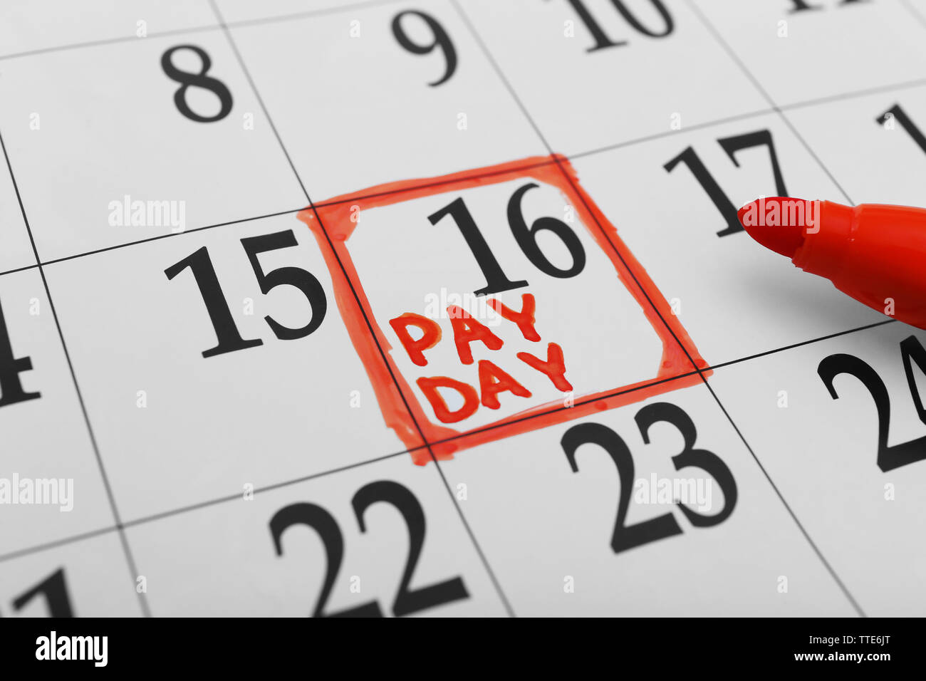 Payday concept. Calendar with orange felt pen background. Date in frame ...