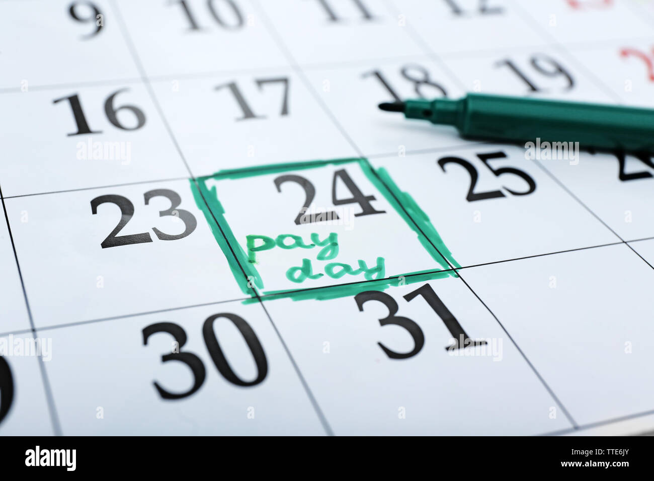 Payday concept. Calendar with green felt pen background. Date in frame ...