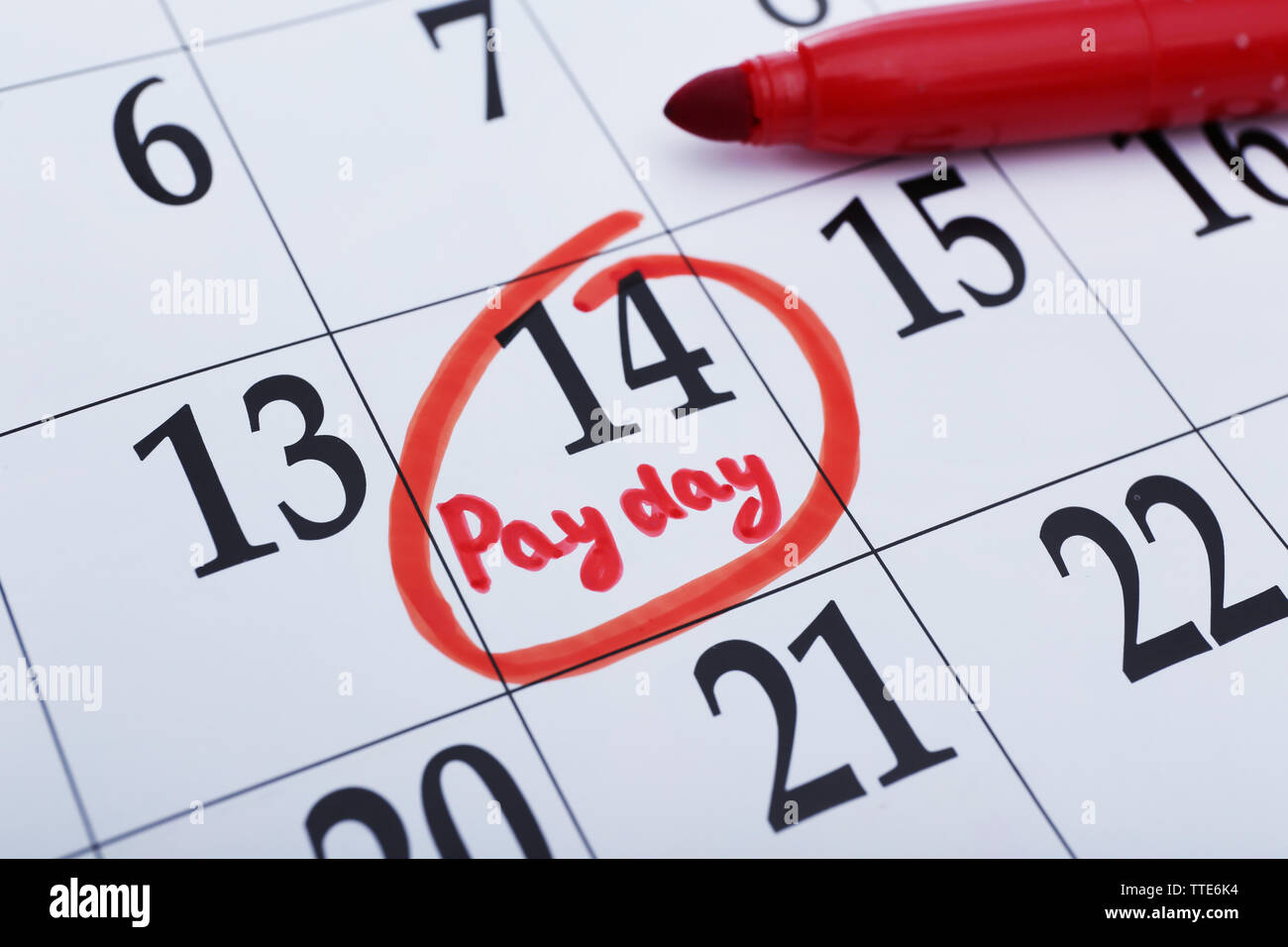 Payday concept. Calendar with red felt pen background. Date in frame ...