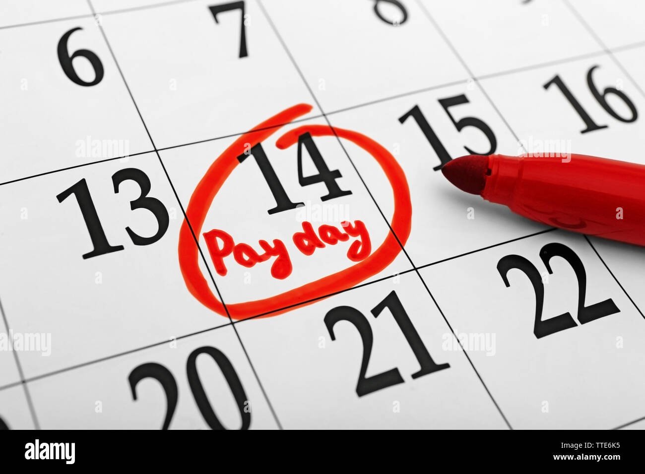 Payday concept. Calendar with red felt pen background. Date in frame ...