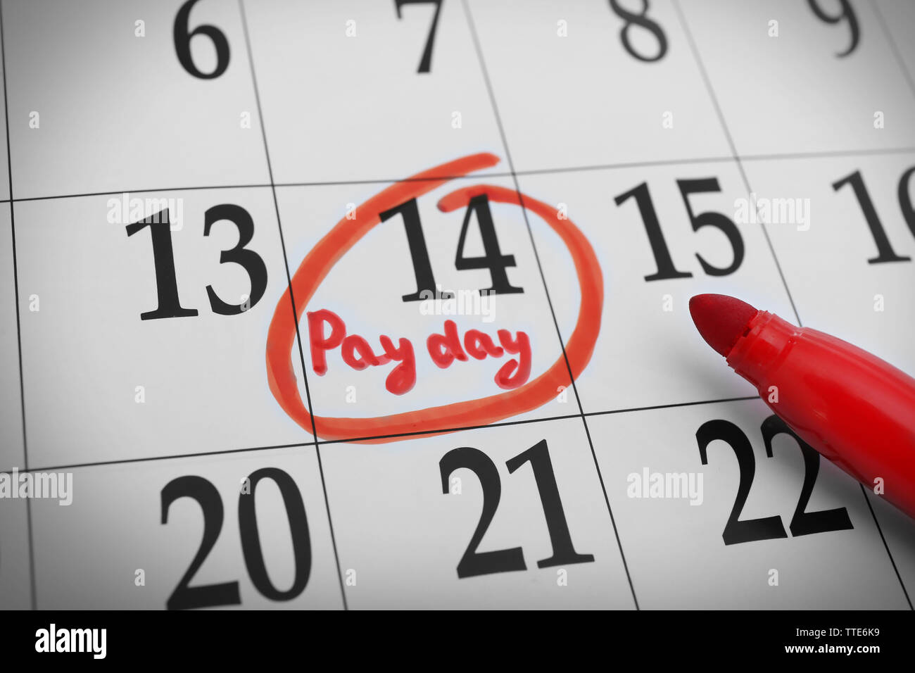 Payday concept. Calendar with red felt pen background. Date in frame ...