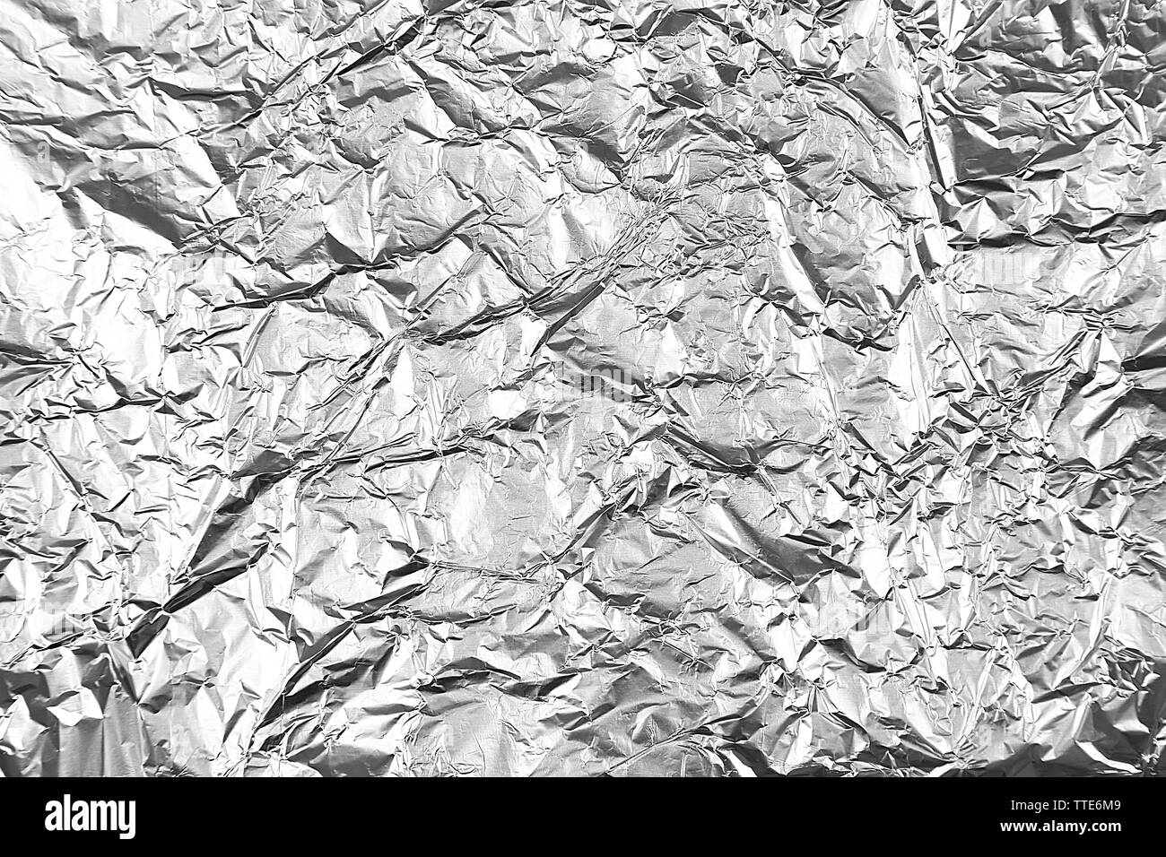 Silver crumpled foil background Stock Photo - Alamy