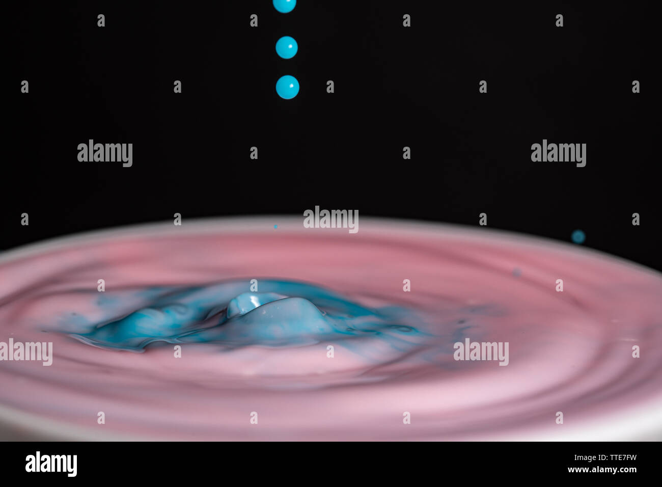 Splash of milk droplets in close up macro high resolution isolated ...