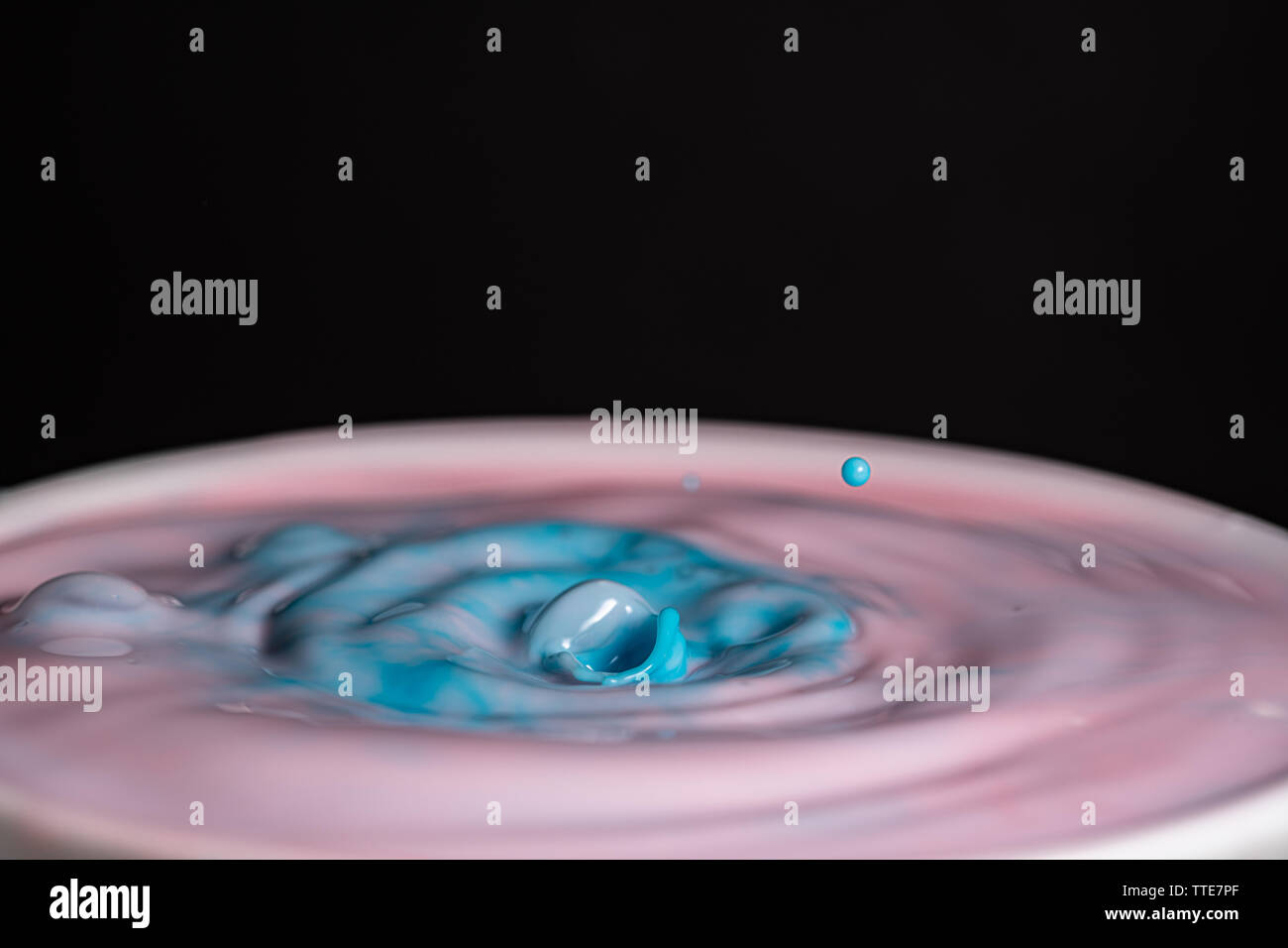 Splash of milk droplets in close up macro high resolution isolated ...