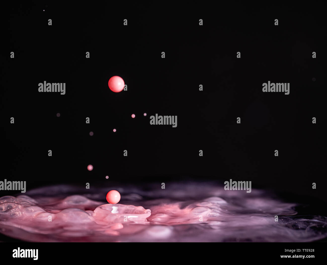 Splash of milk droplets in close up macro high resolution isolated ...