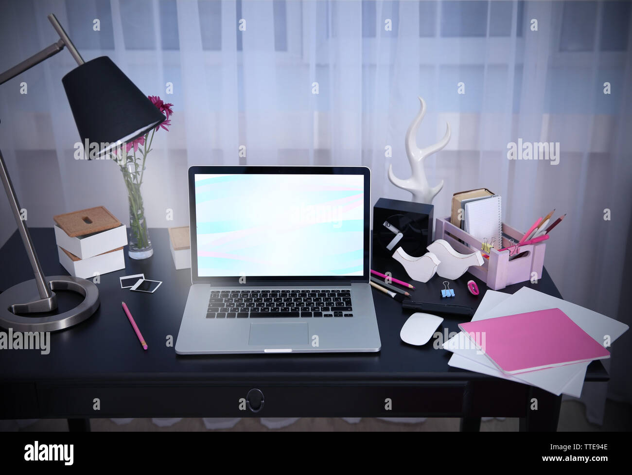 Workplace with laptop on table at home Stock Photo - Alamy