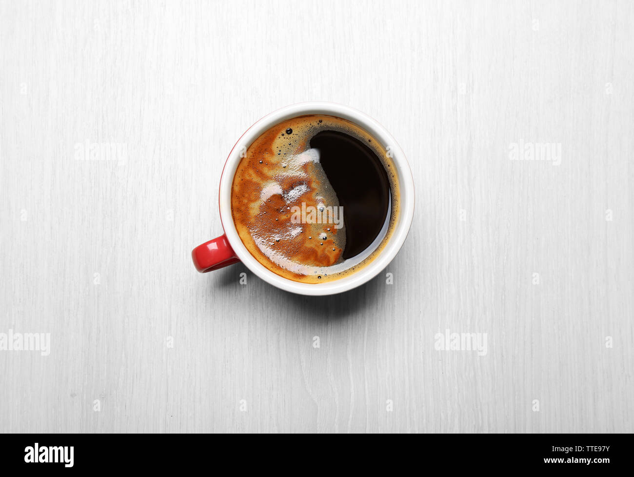 Cup of coffee on light background, top view Stock Photo - Alamy