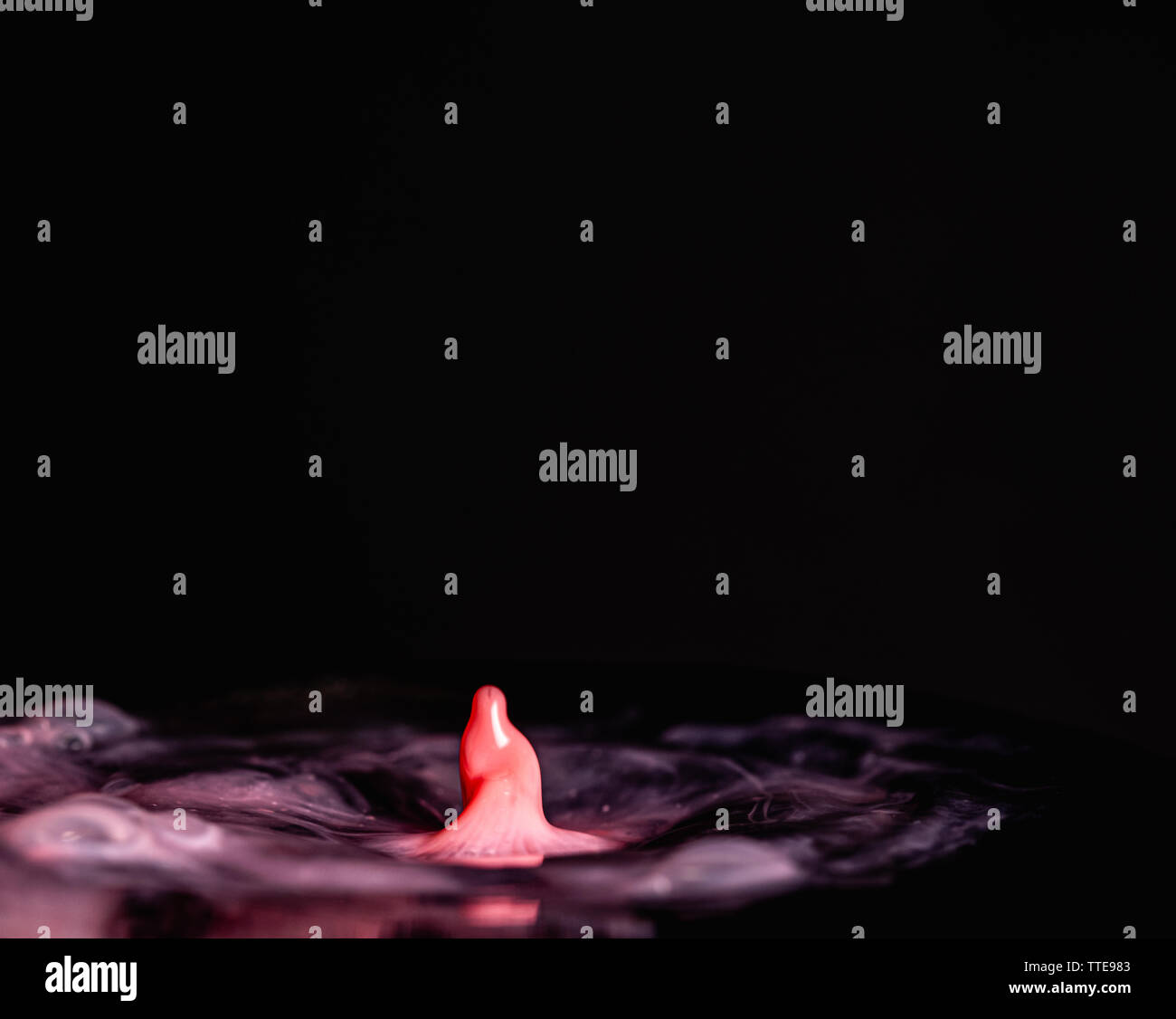 Splash of milk droplets in close up macro high resolution isolated ...