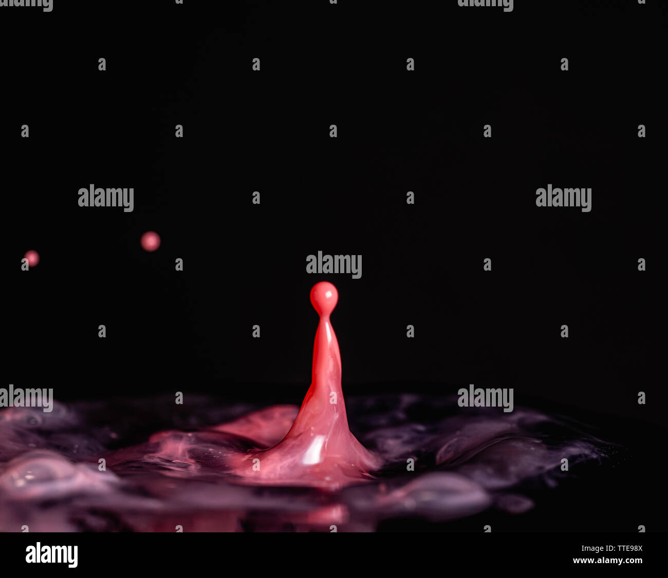 Splash of milk droplets in close up macro high resolution isolated ...