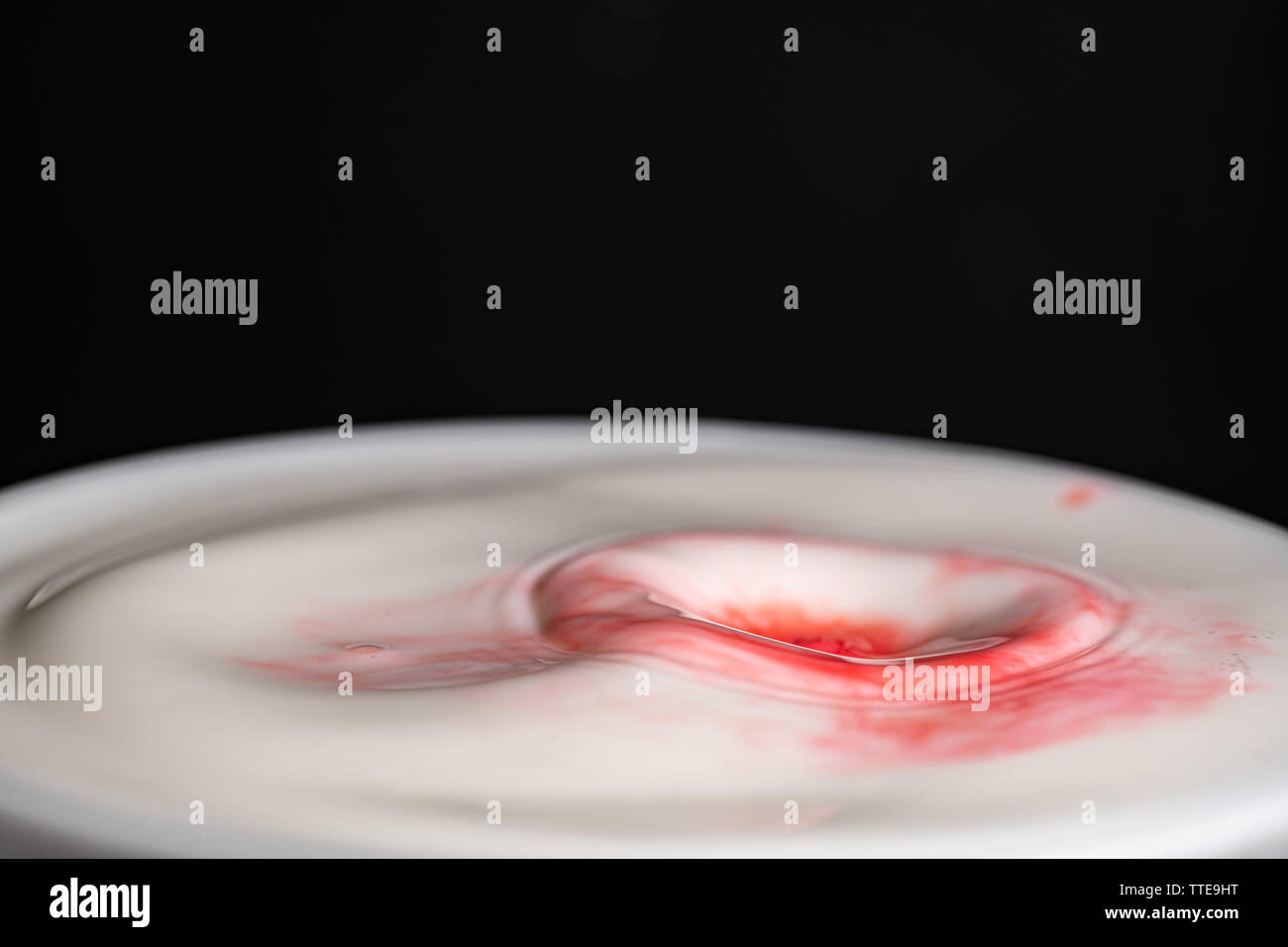 Splash of milk droplets in close up macro high resolution isolated ...