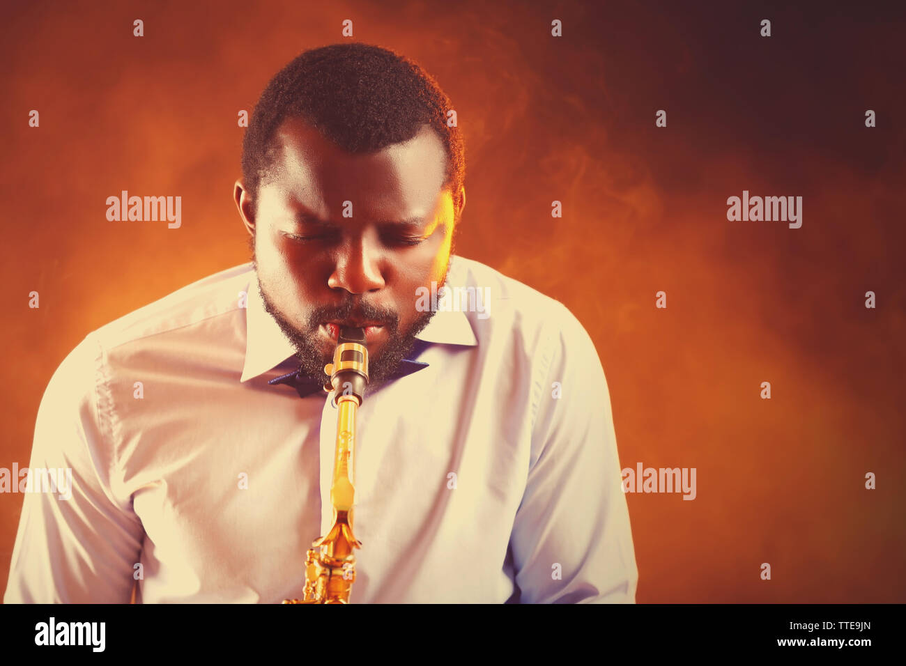 African American jazz musician playing the saxophone on ginger ...