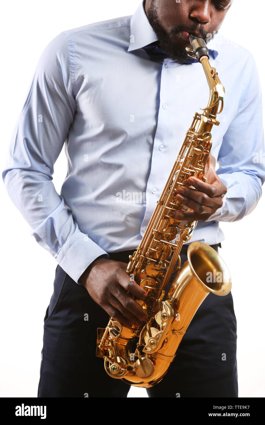 African American jazz musician playing the saxophone, isolated on white ...