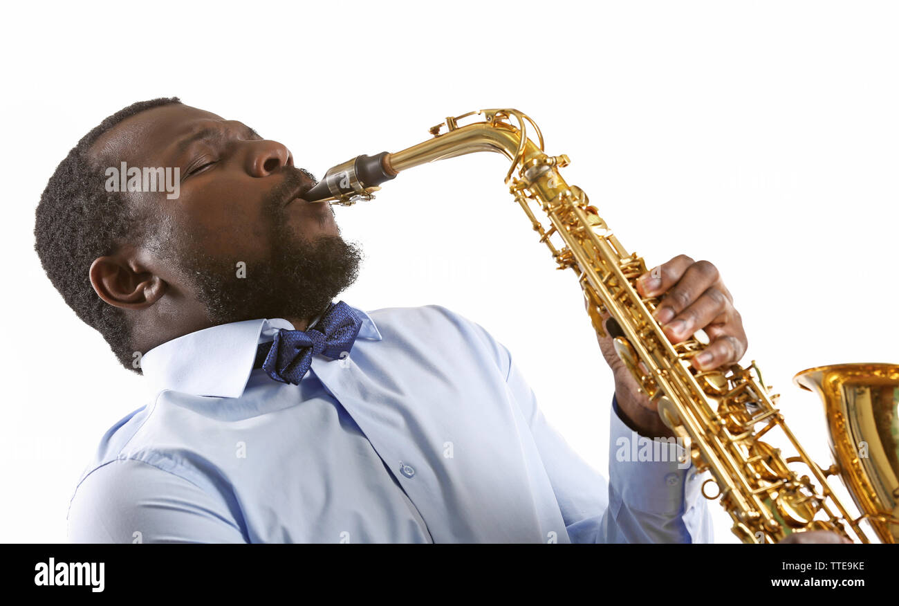 African American jazz musician playing the saxophone, isolated on white ...