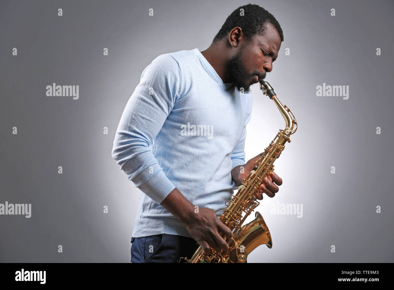 African American jazz musician playing the saxophone Stock Photo - Alamy
