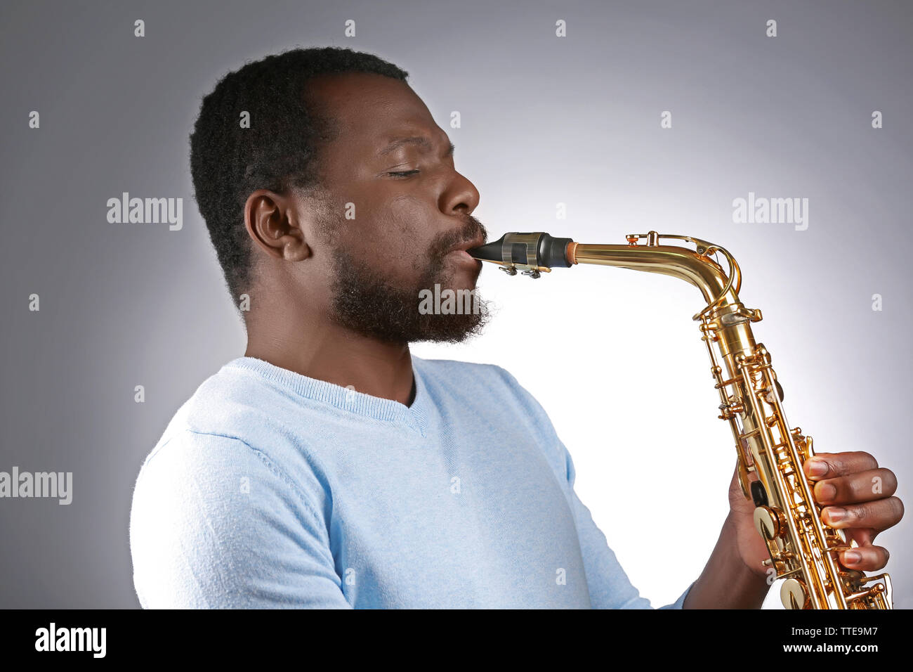 African American jazz musician playing the saxophone Stock Photo - Alamy