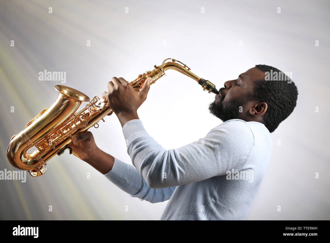 African American jazz musician playing the saxophone Stock Photo - Alamy