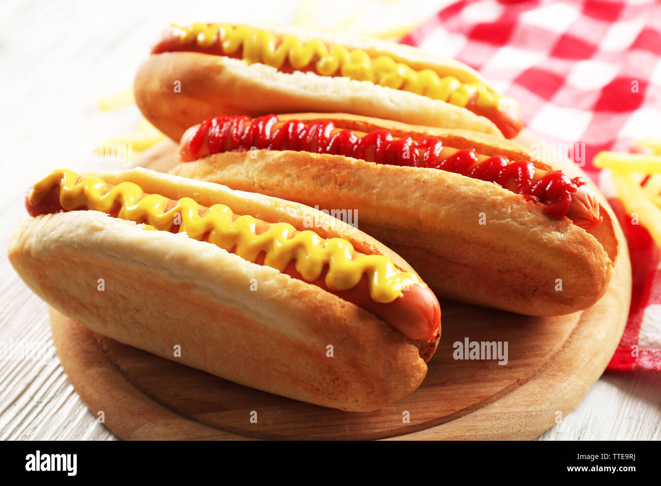 Hot dogs with fried potatoes closeup Stock Photo - Alamy
