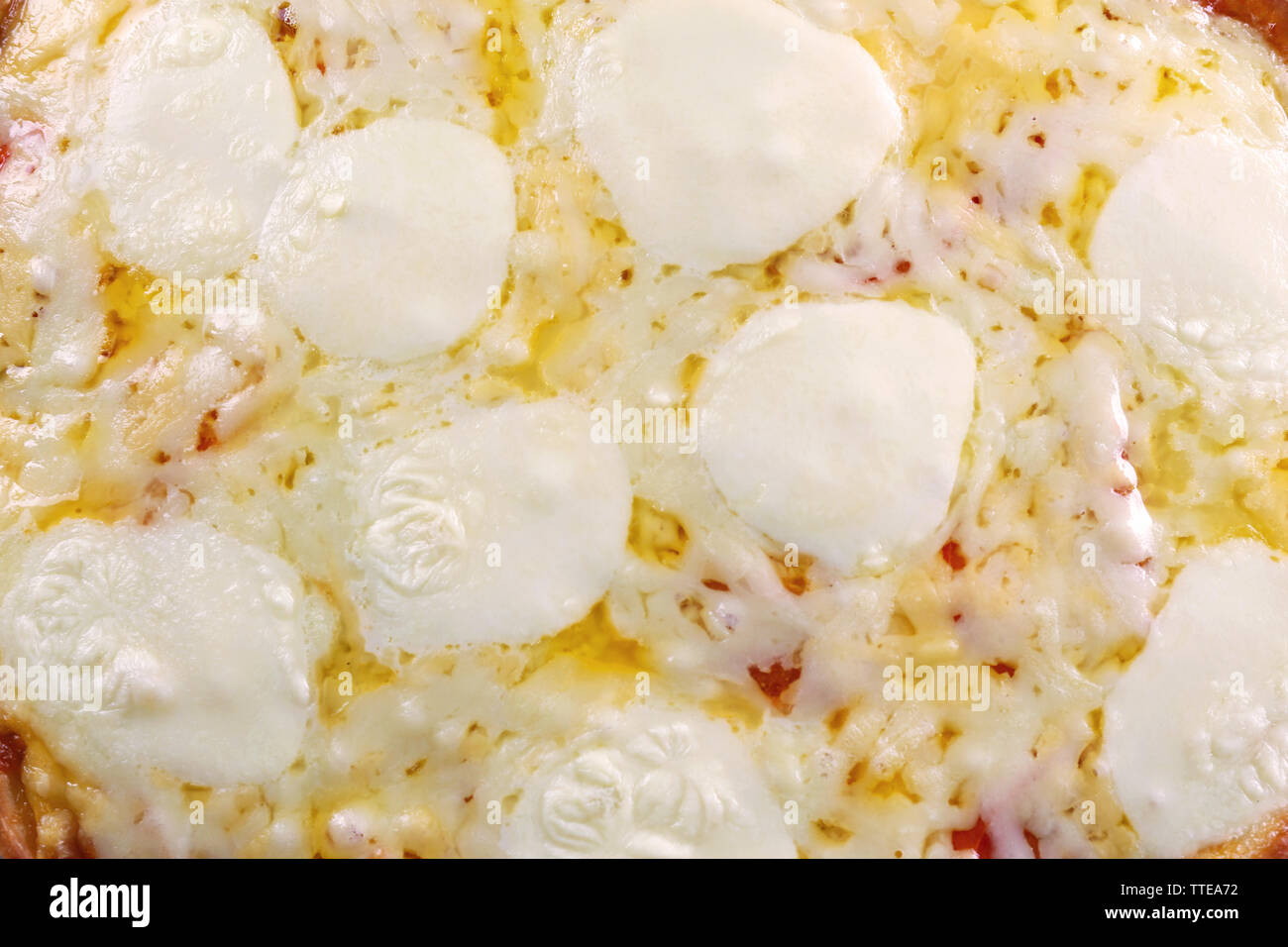 Pizza full of cheese background Stock Photo - Alamy