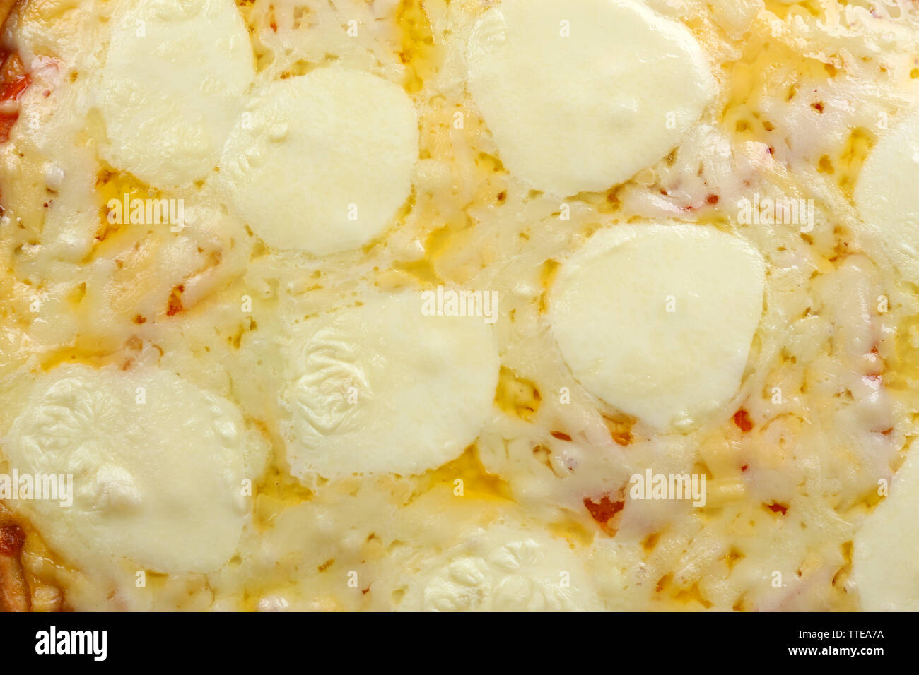 Pizza full of cheese background Stock Photo - Alamy