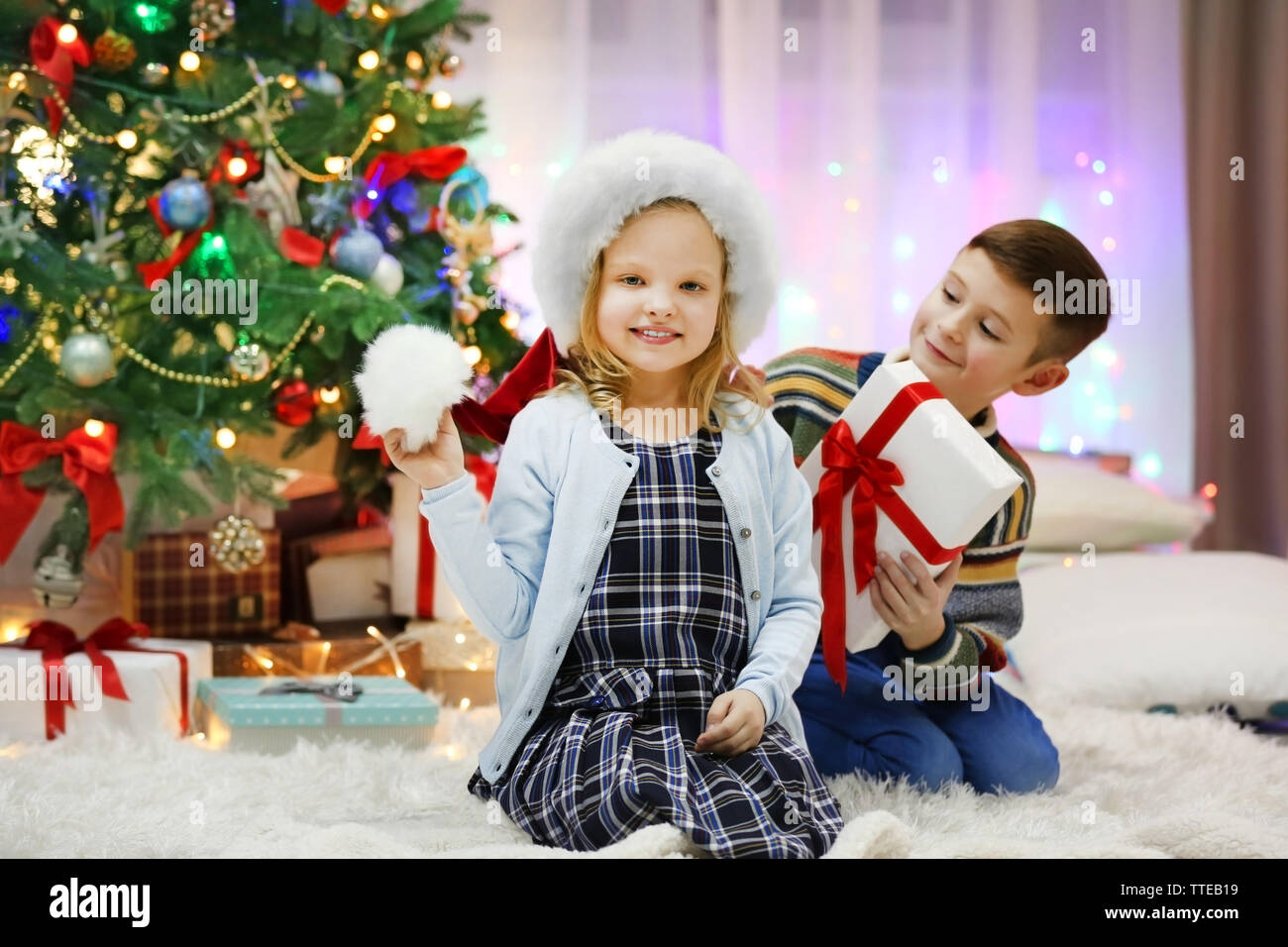 Children playing with gifts hi-res stock photography and images - Alamy