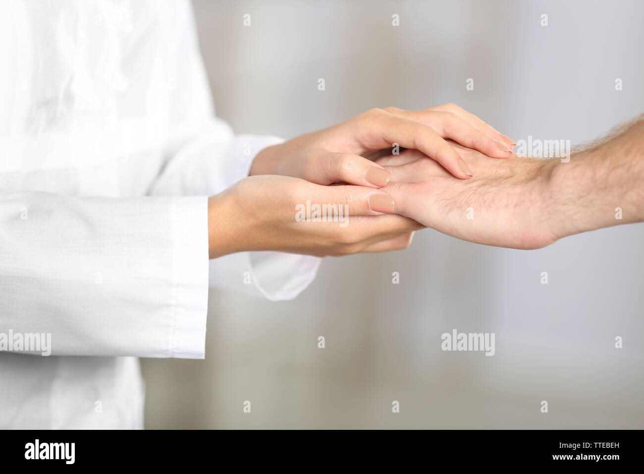 Hand of medical doctor carefully holding patient's hands Stock Photo ...