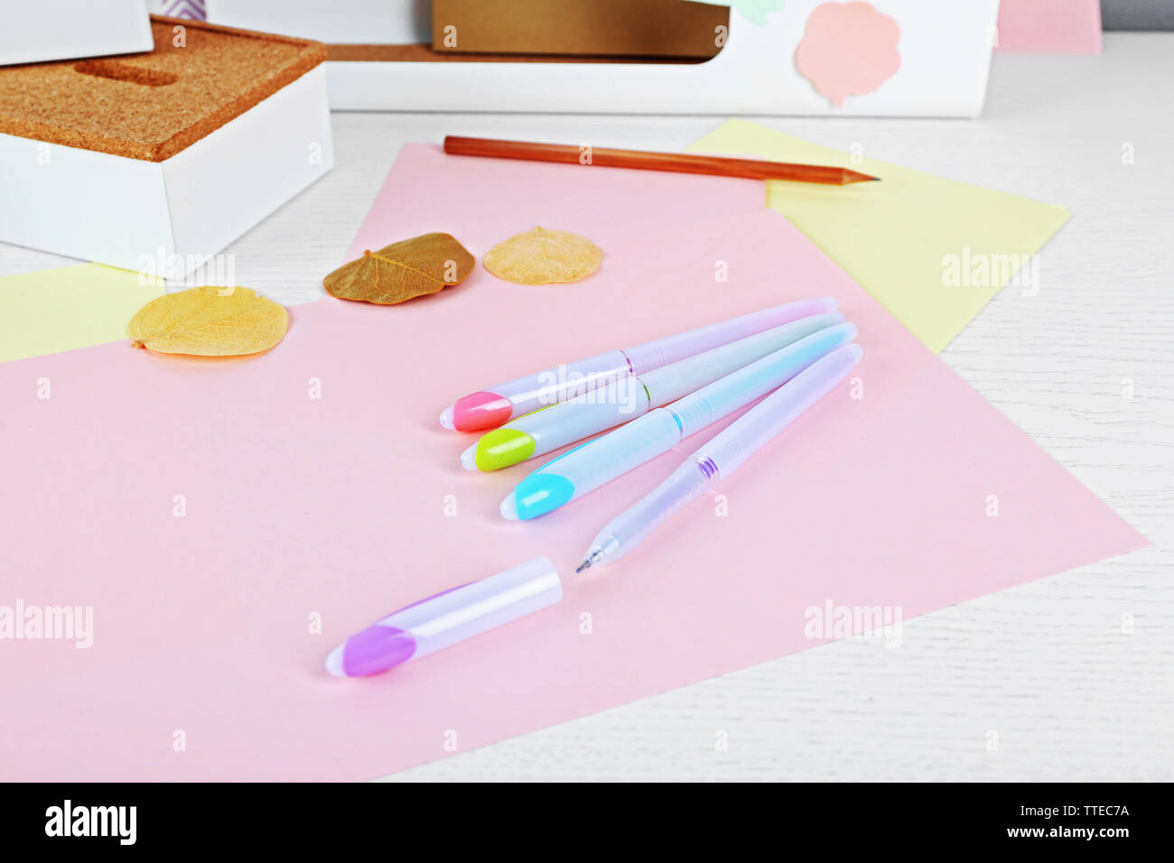 Set of coloured pens on a paper over white background Stock Photo - Alamy