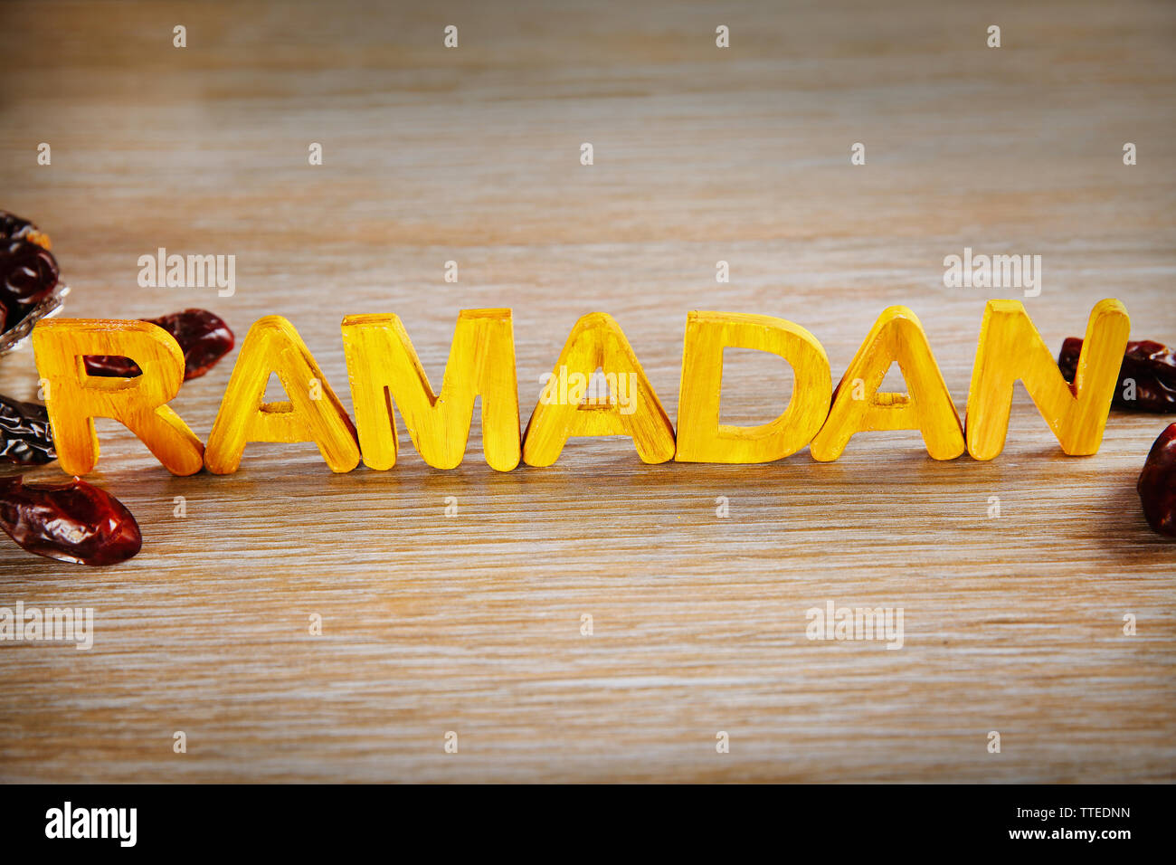 Ramadan word with wooden letters and dry dates on table Stock Photo - Alamy