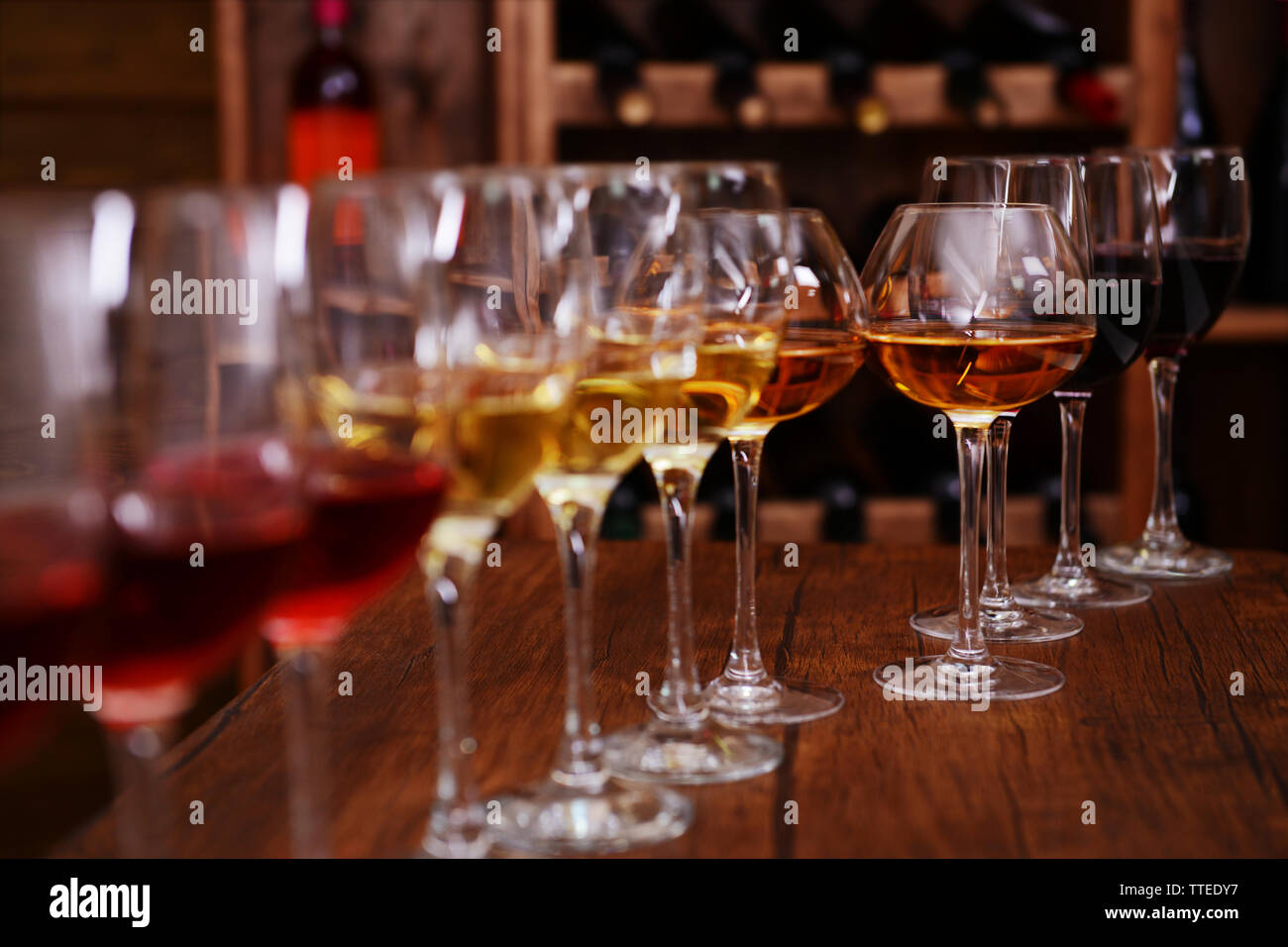 Many glasses of different wine in a row on bar counter Stock Photo - Alamy