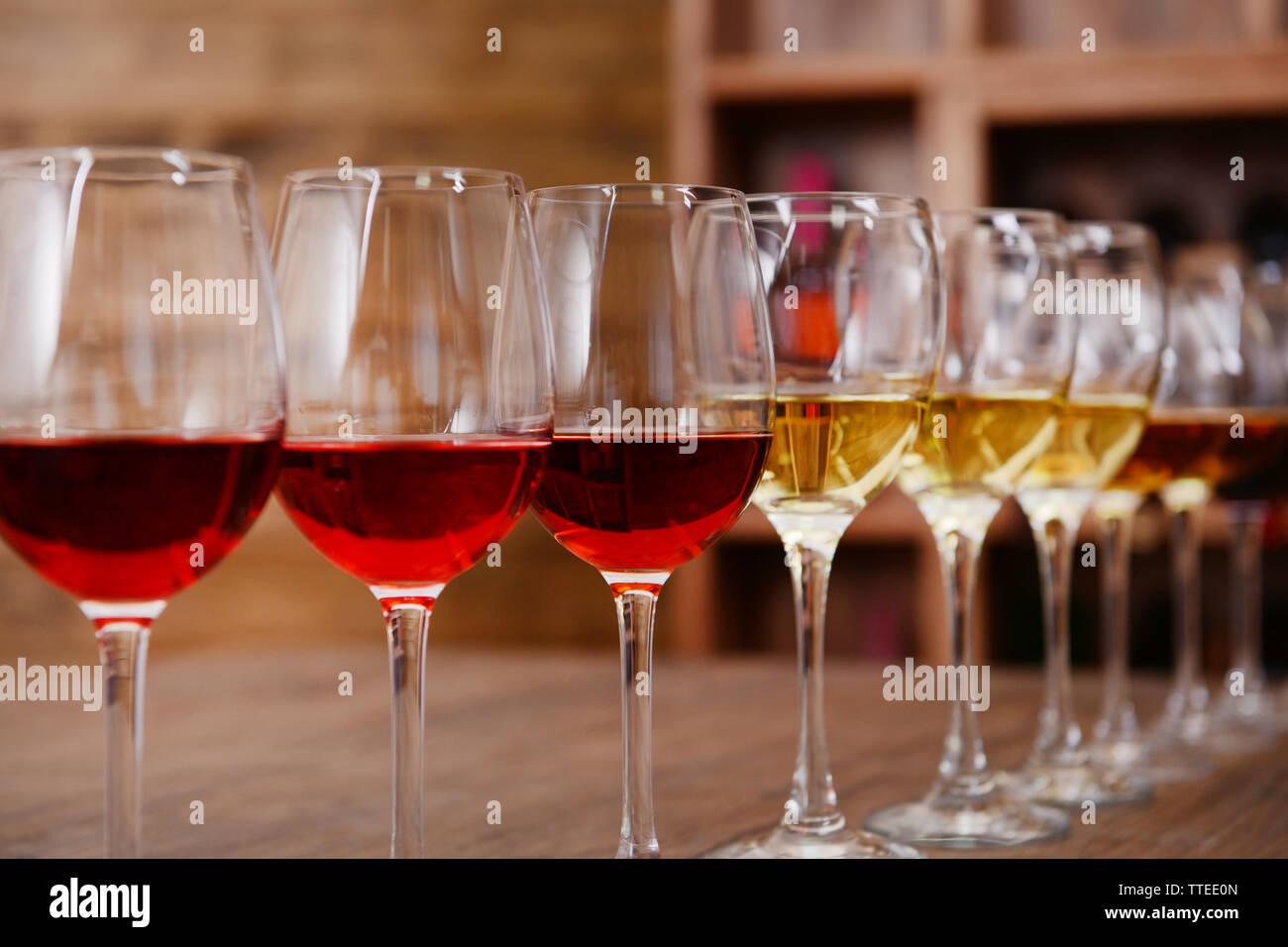 Many glasses of different wine in a row on bar counter Stock Photo - Alamy