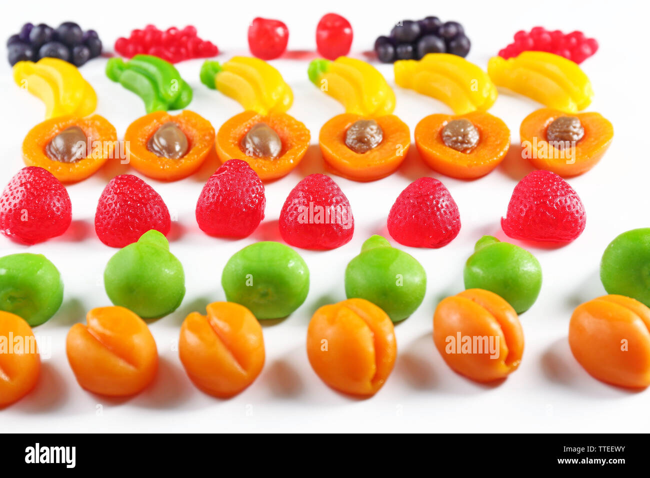 Set of lined colourful fruit jelly sweets, close-up Stock Photo - Alamy