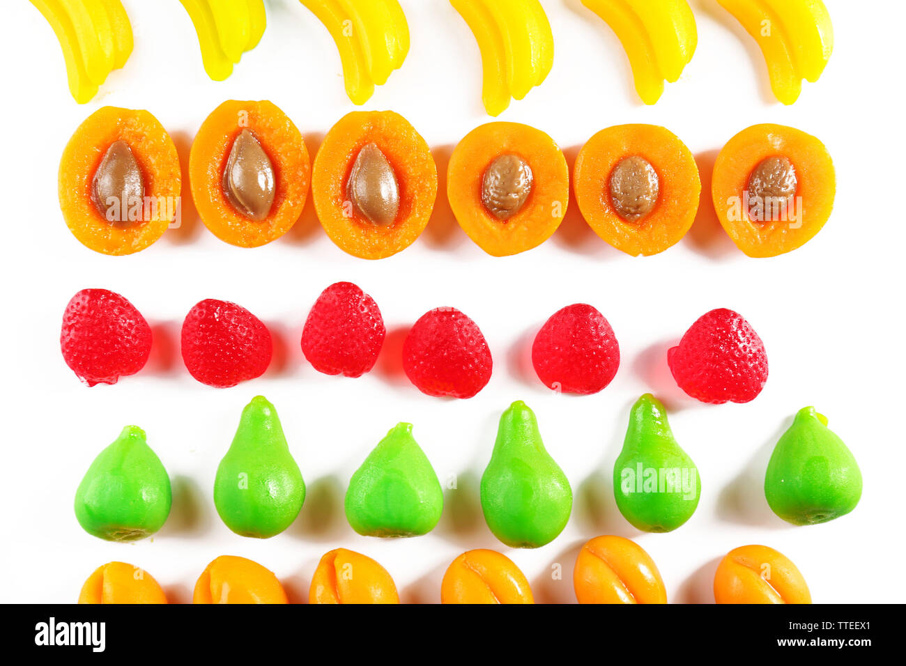 Set of lined colourful fruit jelly sweets, close-up Stock Photo - Alamy