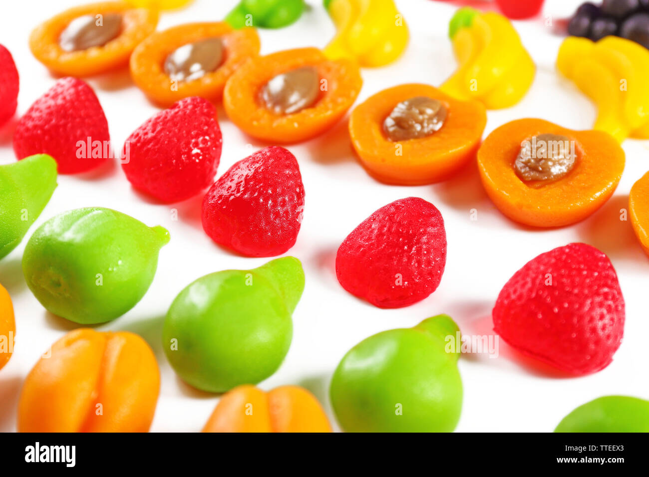 Set of lined colourful fruit jelly sweets, close-up Stock Photo - Alamy