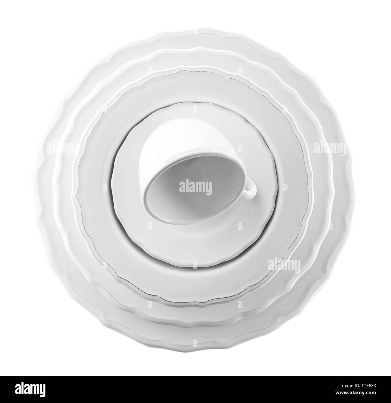 Stack of plates with cup, isolated on white Stock Photo - Alamy